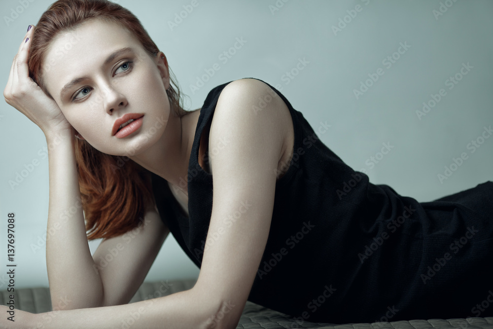 Fashion beauty portrait of young red-haired model with long straight ...