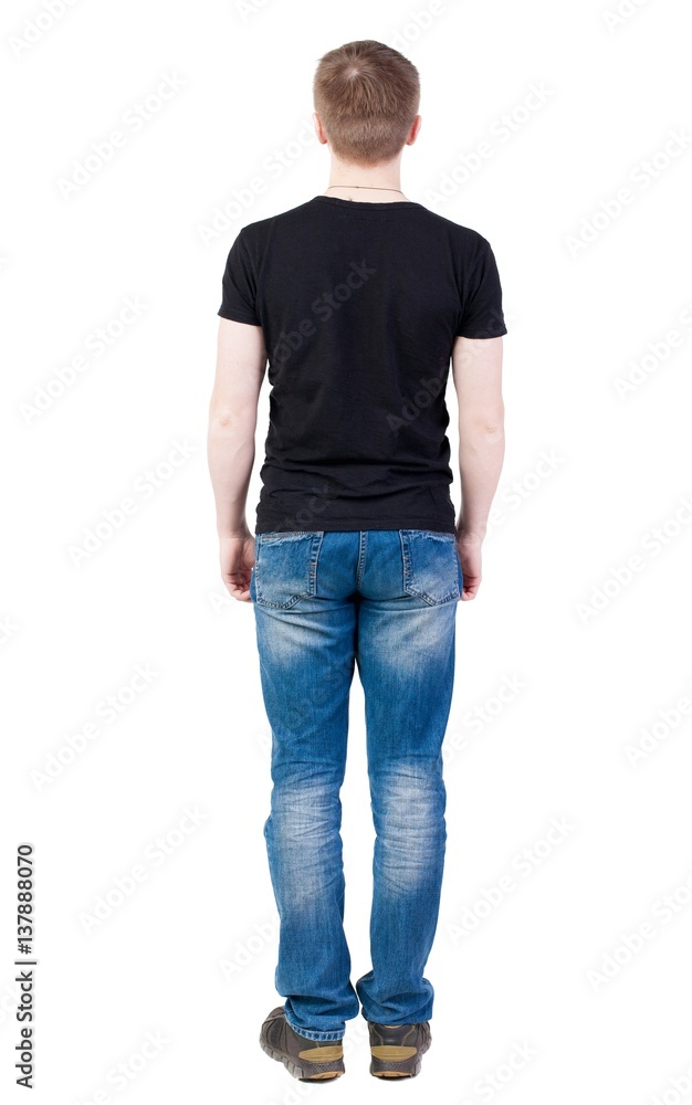 Back view of man in jeans. Standing young guy. Rear view people ...