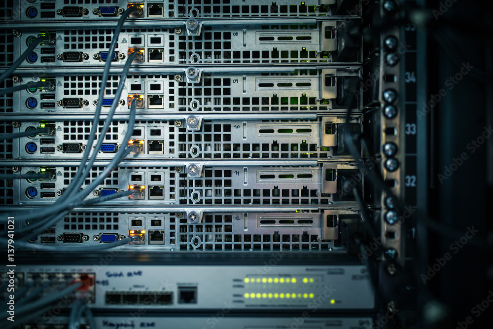 Server rack cluster in a data center (shallow DOF; color toned image ...