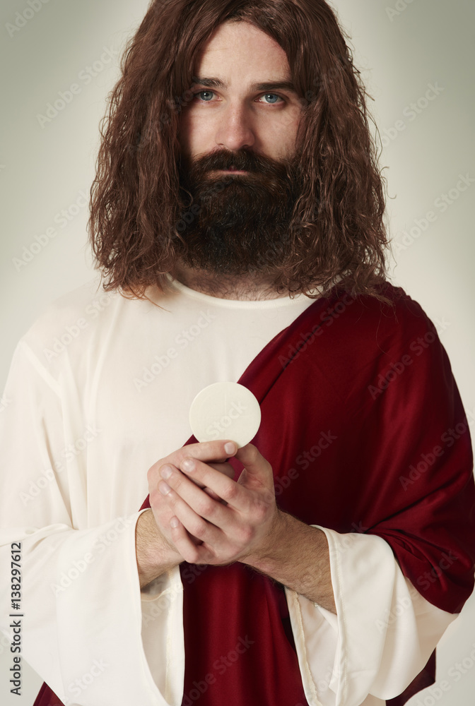Jesus with the sacred object which is Host ... Stock Photo | Adobe Stock