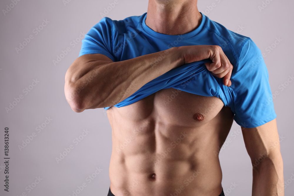 Muscular Men, perfect body, abs, six pack. Strong athletic guy showing ...