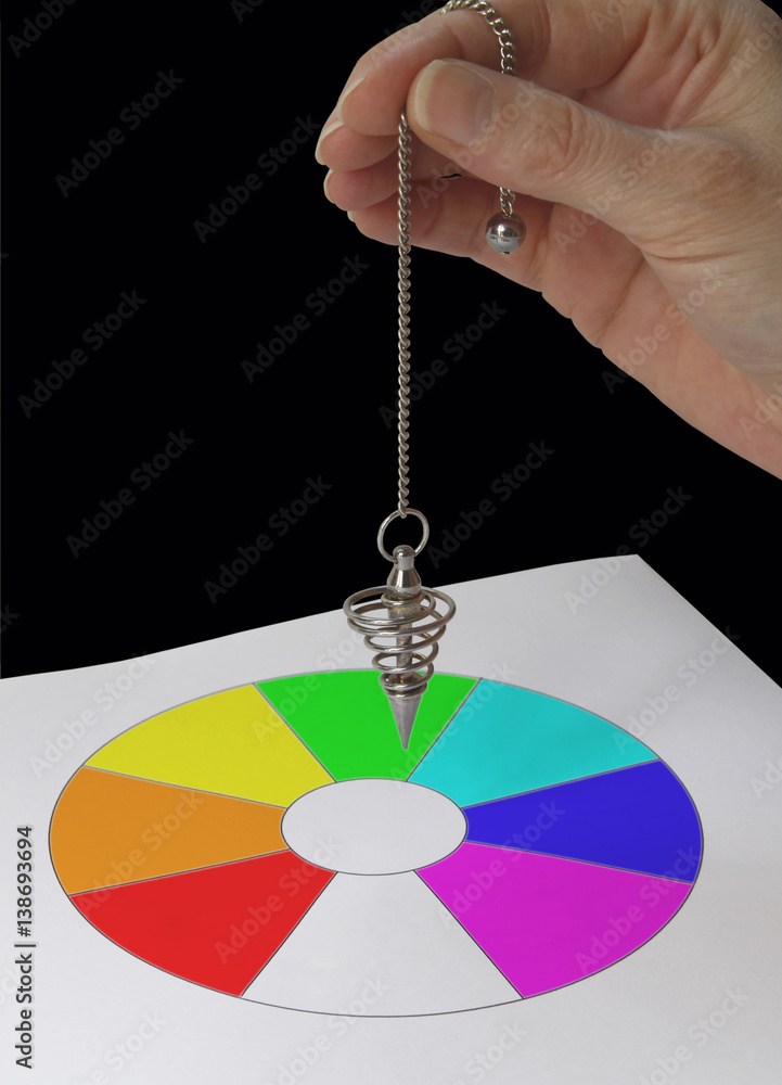 Radionics practitioner with Color Dowsing chart - female hand holding a ...