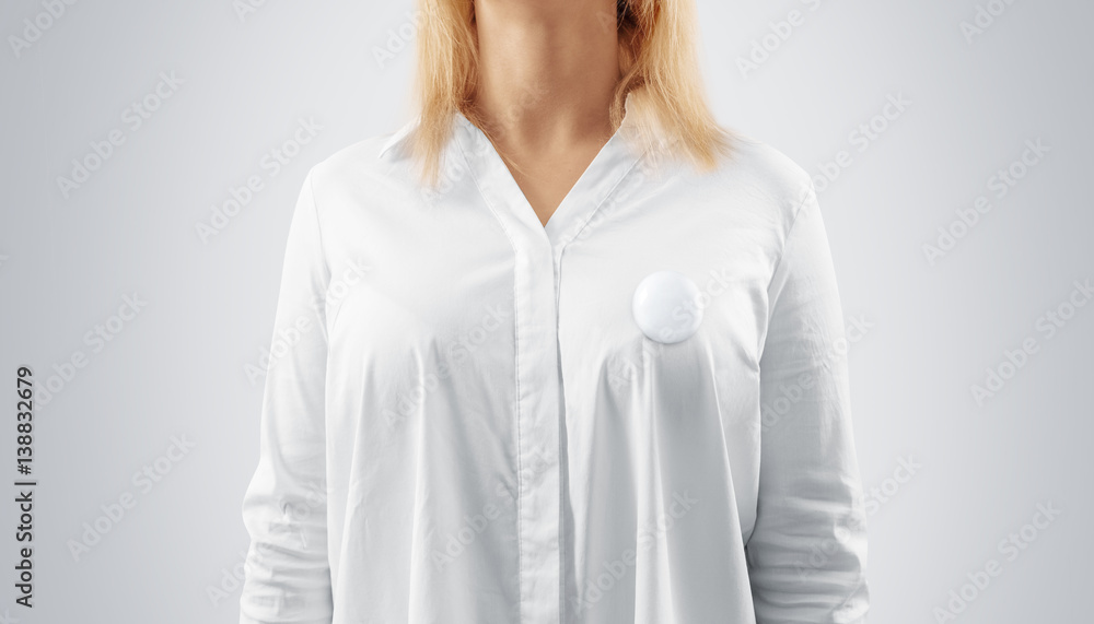 Blank button badge mockup pinned on the womans chest. Girl wear white ...
