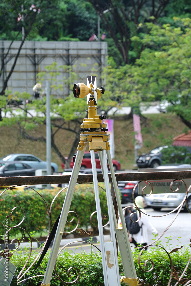 A survey equipment used by land surveyor at construction site to ...