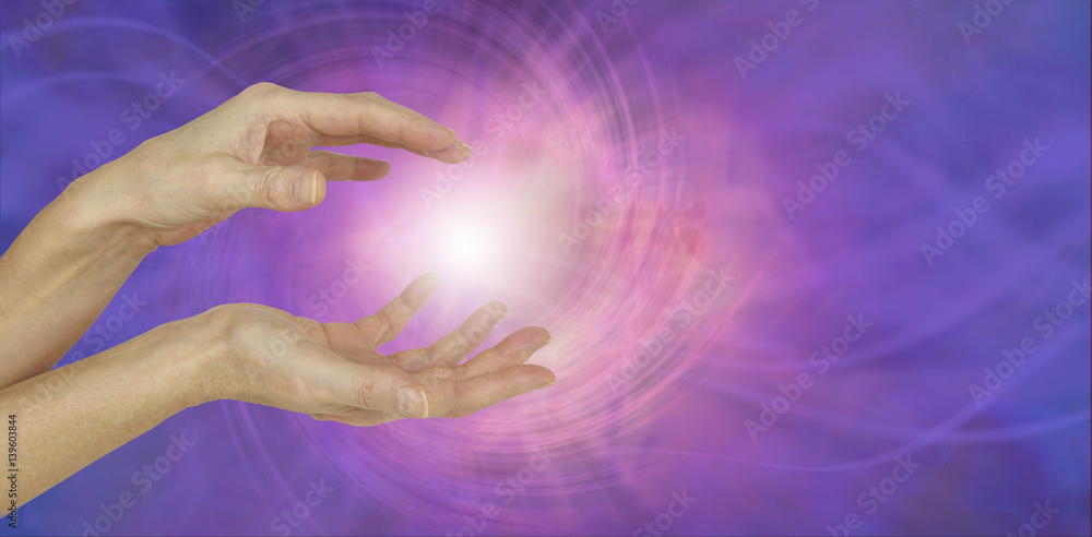 White Orb Energy Between Hands - a pair of female hands with a white ...