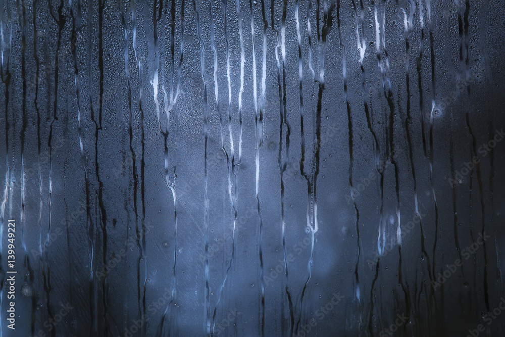 Dark blue rainy window with scary pattern of the raindrops paths Stock ...