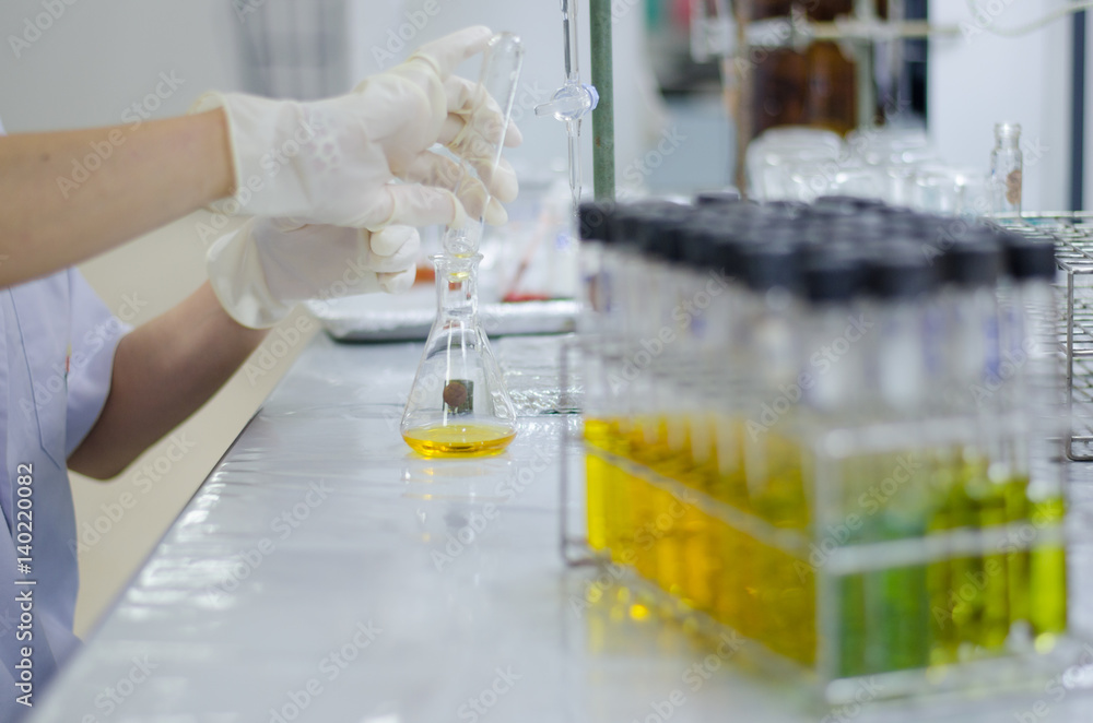 Scientist hand titration at laboratory, titrate chemical, titration ...