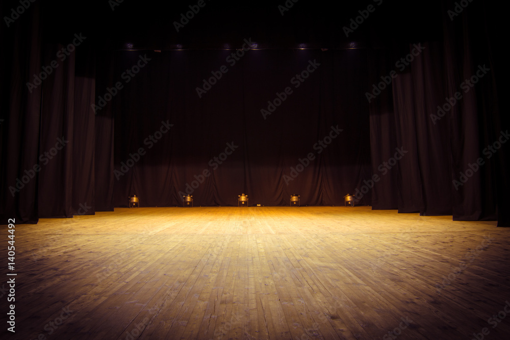 An empty stage of the theater, lit by spotlights before the performance ...