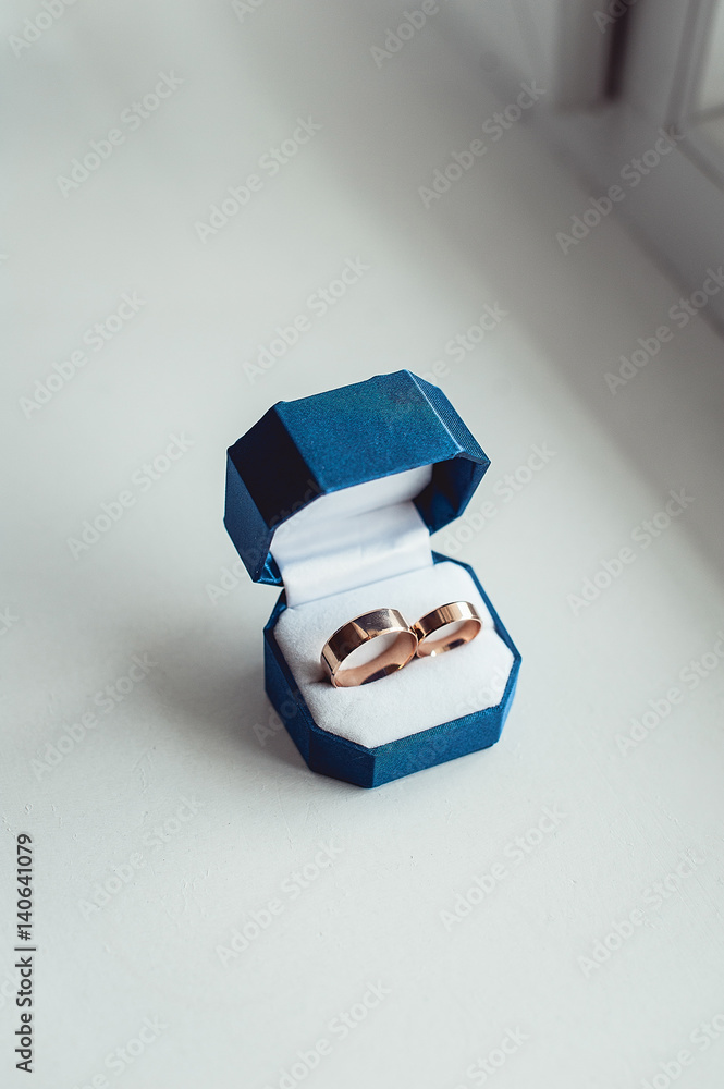 two wite wedding rings in blue box on a white window sill Stock Photo ...