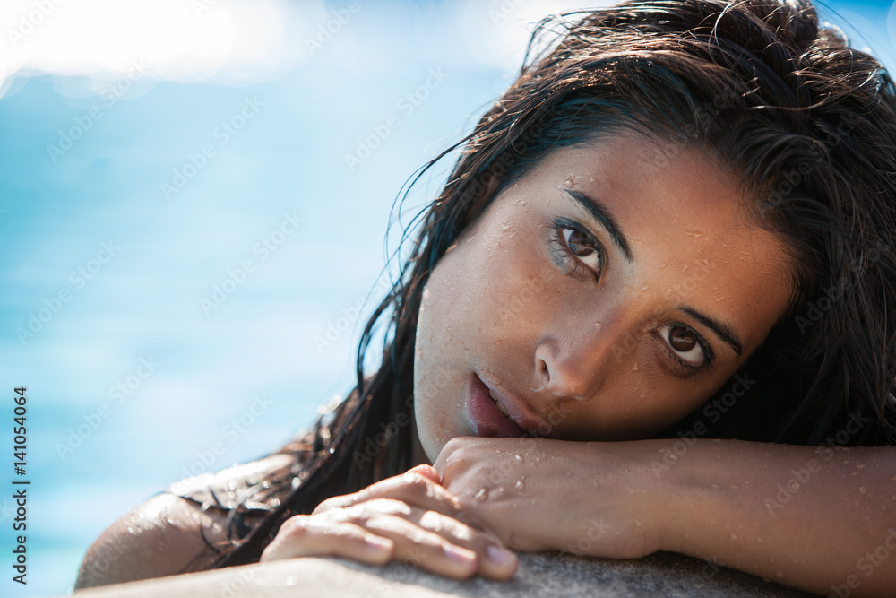 beautiful young latina woman in pink bikini portrait at swimming pool ...
