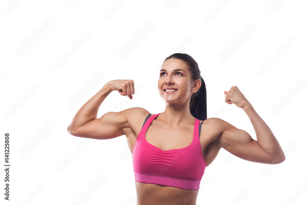 Young beautiful strong woman shows biceps and smiles. Isolated, white ...