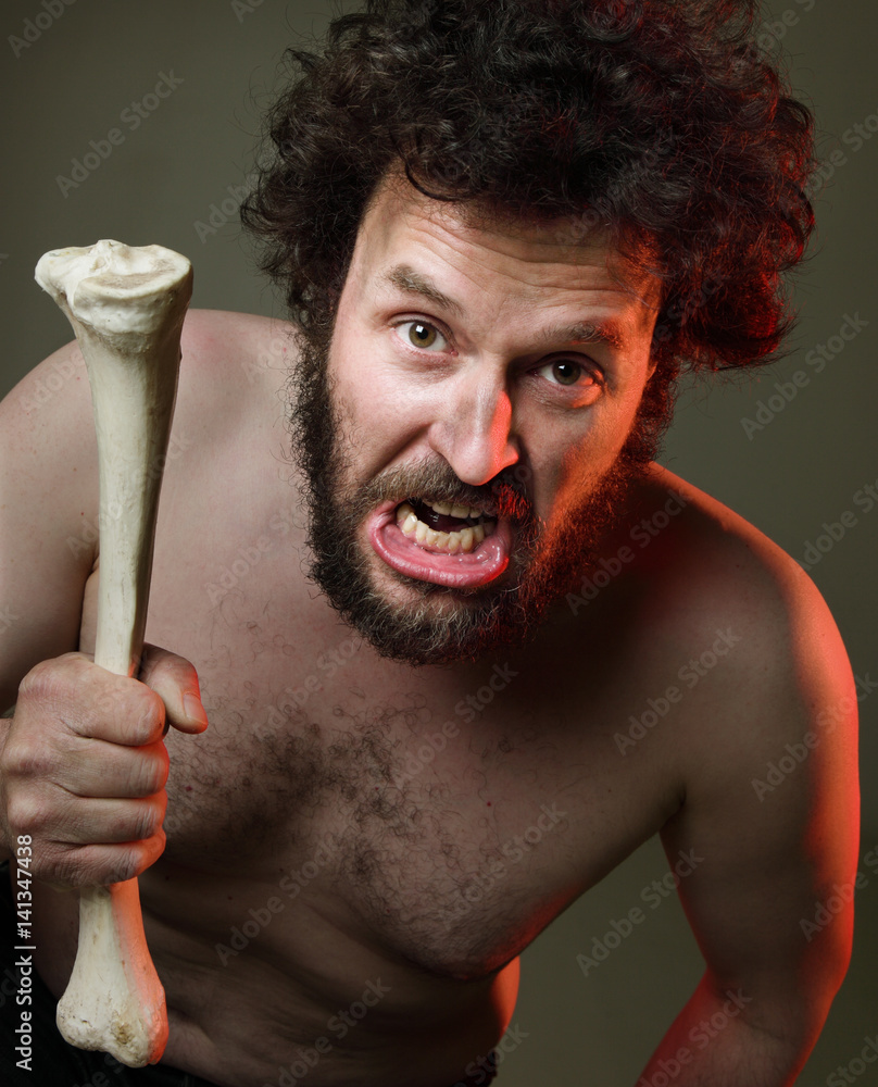 Caveman, manly man with Big Bone, showing of his strength and ...