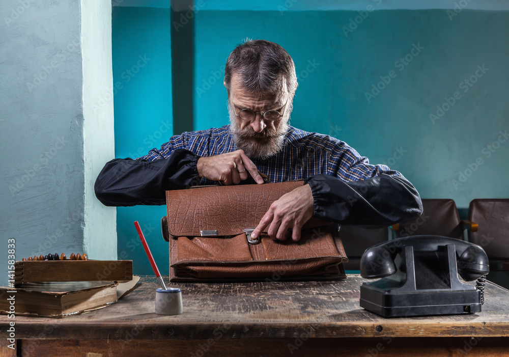 Accountant opens a portfolio Stock Photo | Adobe Stock
