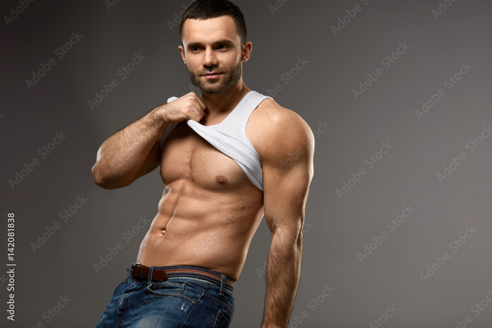 Handsome Athletic Man With Sexy Muscular Body Taking Off Clothes Stock ...