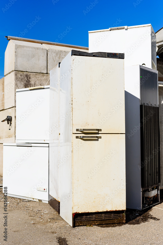 Discarded fridges and freezers at a local waste station. Here they ...
