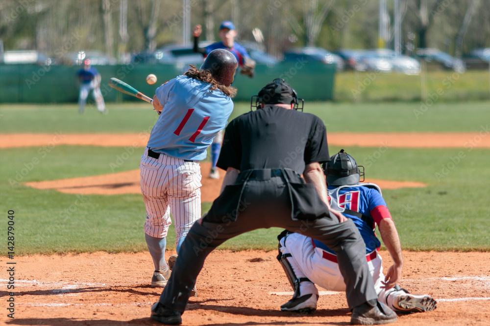 Foto de Stock Baseball batter hits ball | Adobe Stock