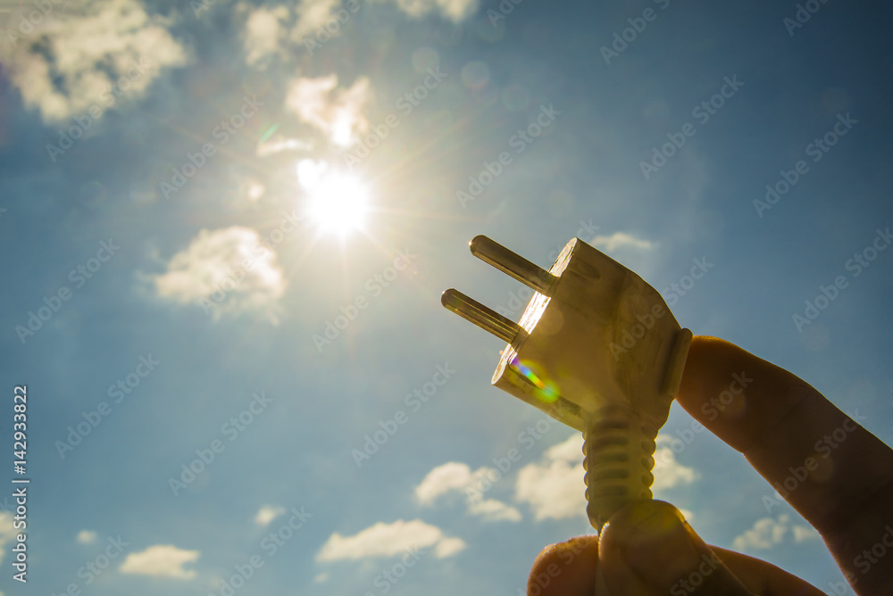 symbolic solar energy theme showing the sun and sky with human hand ...