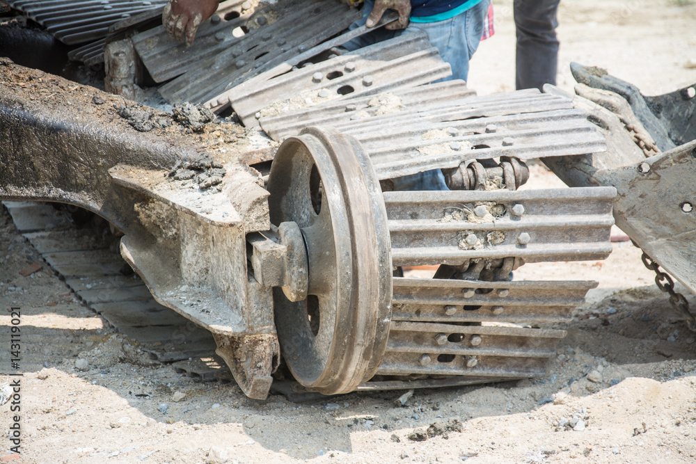 man fix backhoe wheel ,broken of backhoe wheel Stock Photo | Adobe Stock