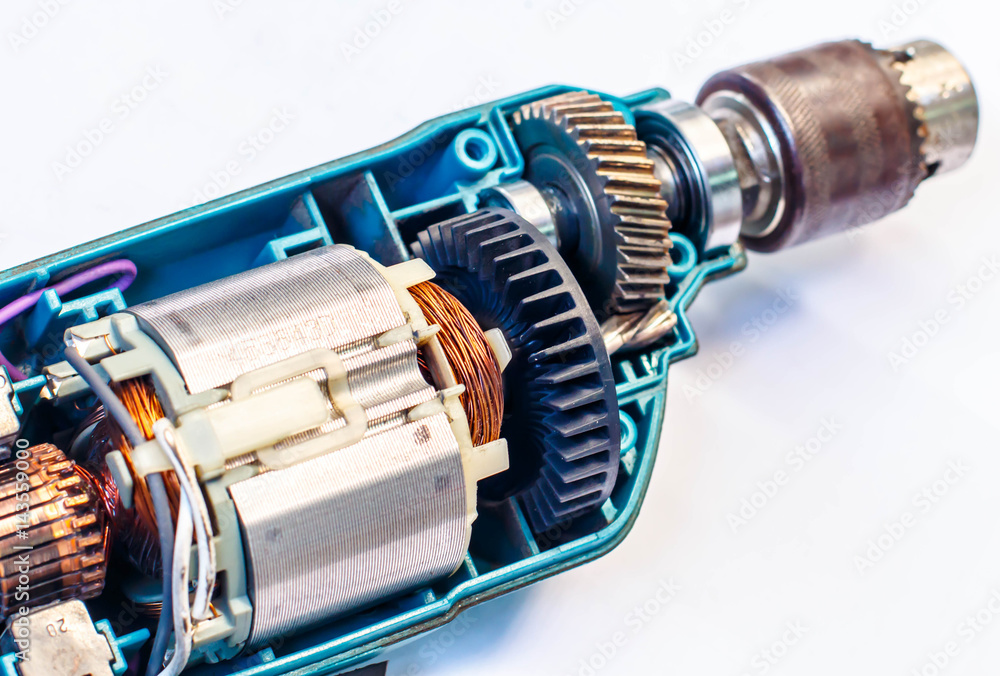 Disassembled electric drill isolated on white background, opened cover ...
