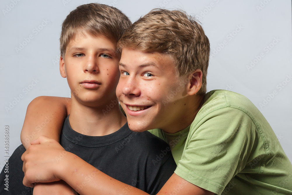 two boy hug