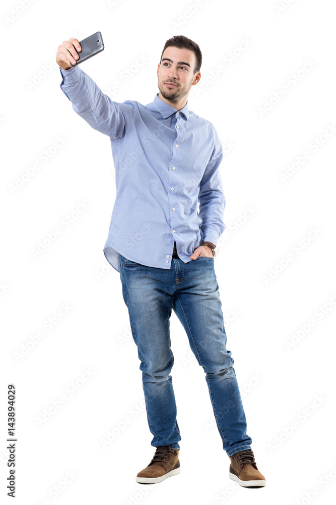 Happy successful businessman taking selfie looking at smart phone. Full ...