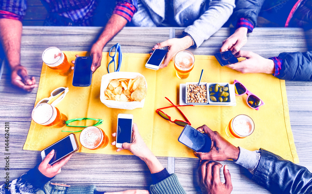 Group of friends texting phone message inside pub top view image ...