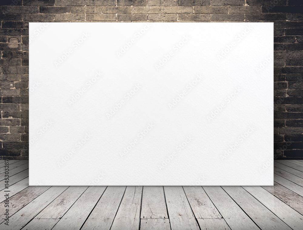 Blank long white paper poster at grunge brick wall and plank wood floor ...
