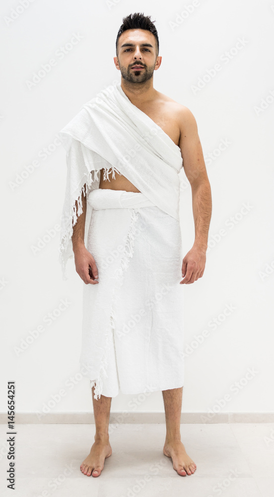 Muslim man posing as ready for Hajj visiting Kaaba in Mecca Stock Photo ...