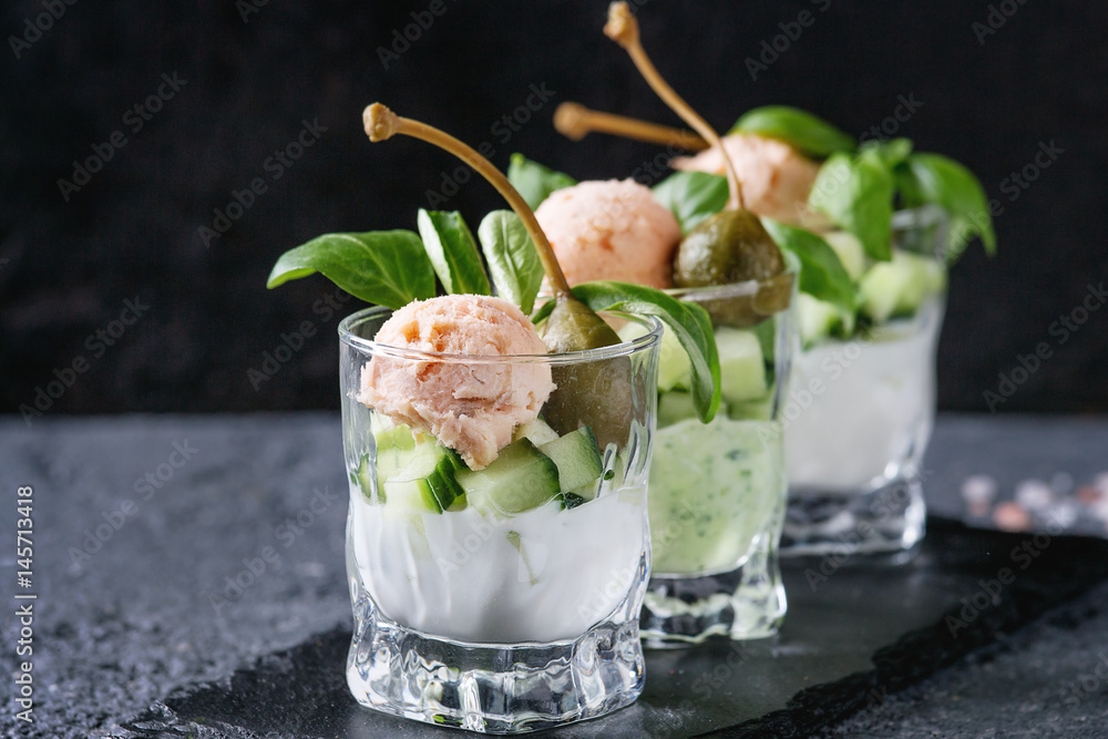 Verrines appetizer with salmon pate, red caviar, cucumber, cream cheese ...