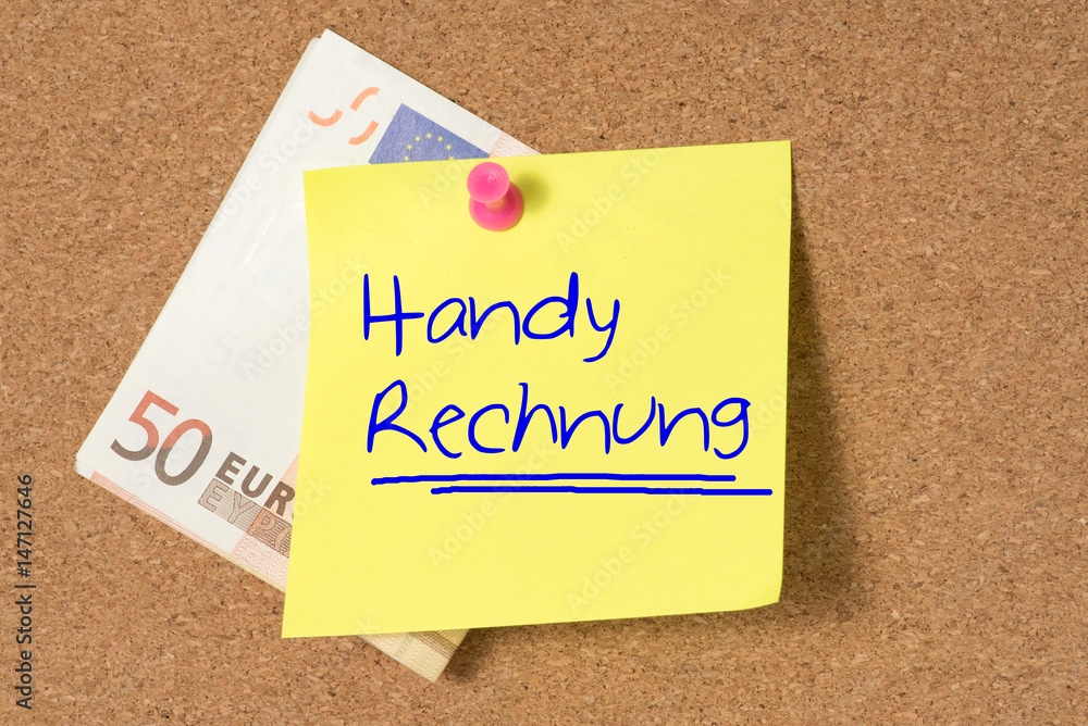 Ein Euro Geldschein einer Pinnwand und ein Zettel mit dem Text Handy ...