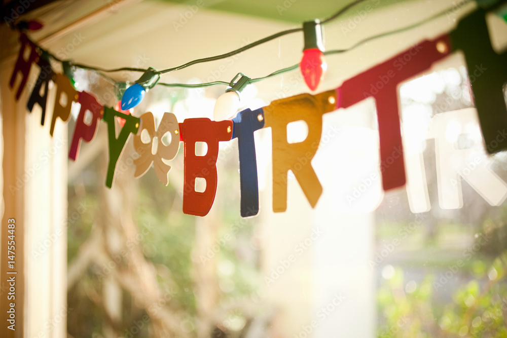 Birthday banner hanging in window Stock Photo | Adobe Stock