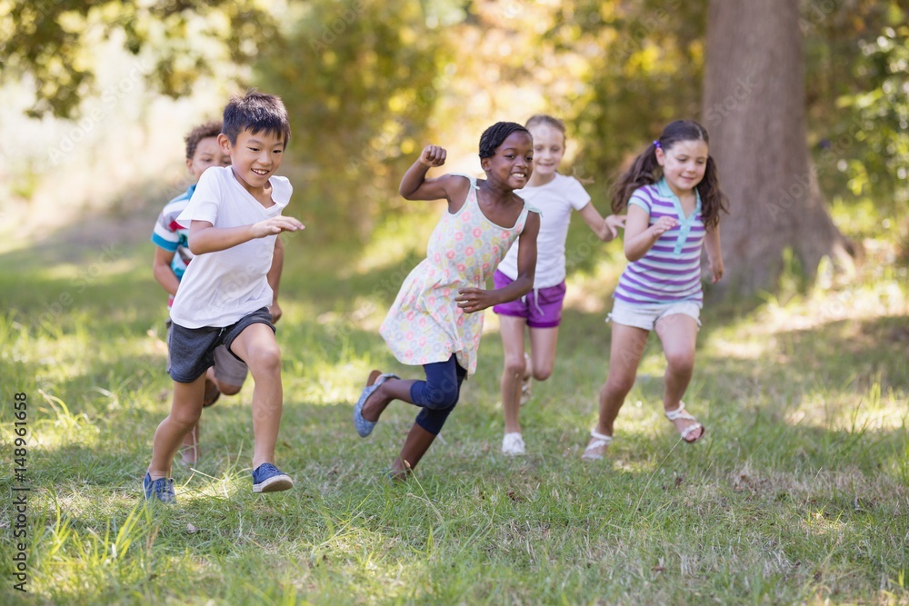 Playful children running at campsite Stock Photo | Adobe Stock