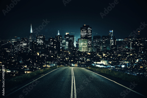 Road leading to night city - Buy this stock photo and explore similar ...
