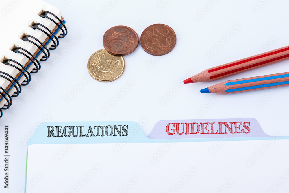 Regulations and Guidelines. Folder Register on a white Office Table ...