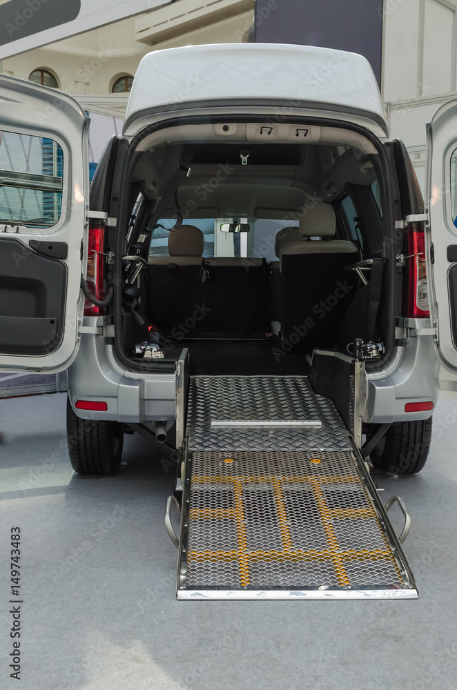 Ramp for the disabled in a car with open rear doors. Assistance in the ...