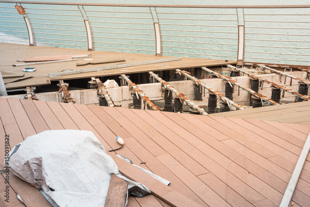 Remodel of timber boardwalk, wooden walkway on shore of Singapore sea ...