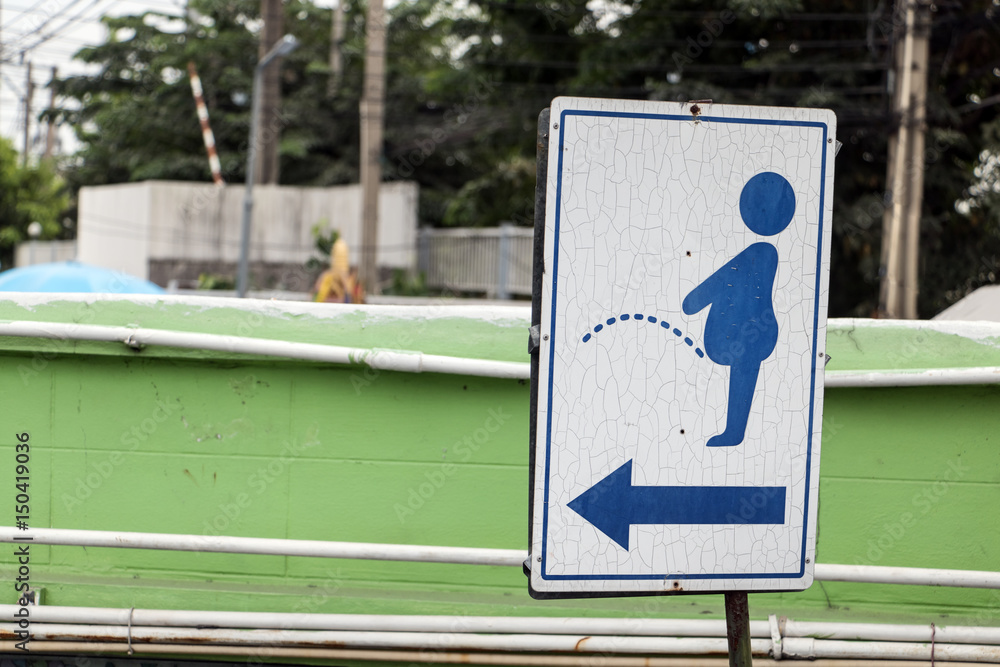 Indicator of the direction of way to a public restroom. Signs with a ...