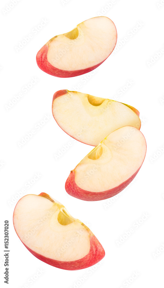 Isolated flying apple wedges. Four falling pieces of red apple fruit ...
