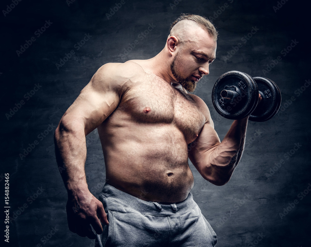 Studio portrait of shirtless bodybuilder. Stock Photo | Adobe Stock
