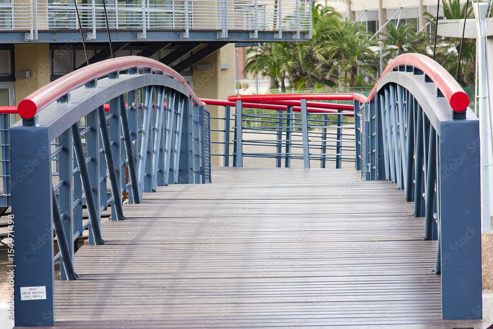 Rails and balustrading on a boardwalk at the residential precinct of ...