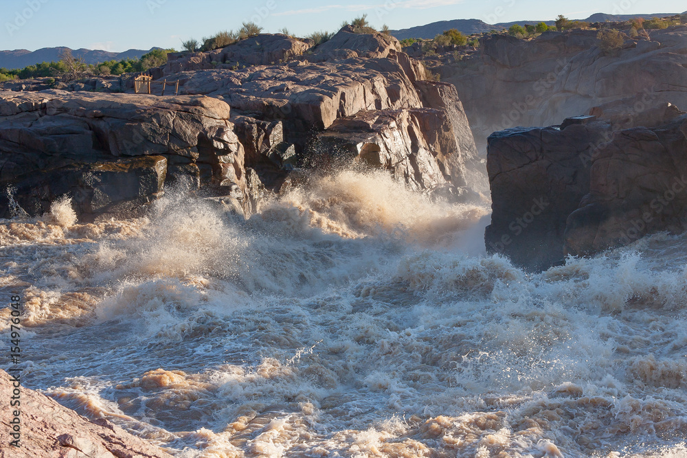 Dangerous waters as the Orange River, in full flood, races towards the ...