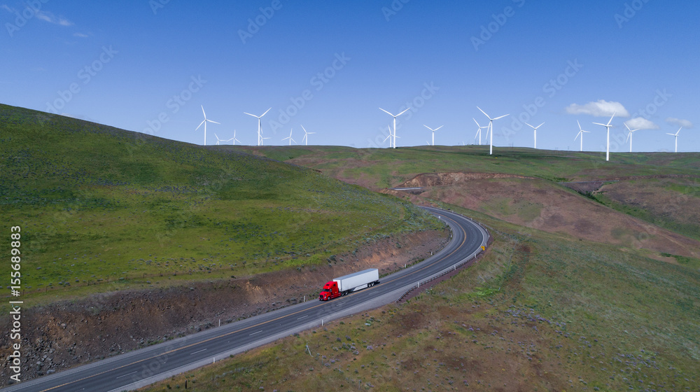Windy road with semi-truck and trailer driving Stock Photo | Adobe Stock