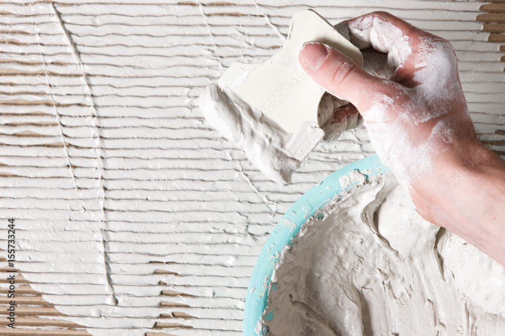 Stock-Foto „Plaster Repair Worker Hand Spatula Stucco White Free Space ...