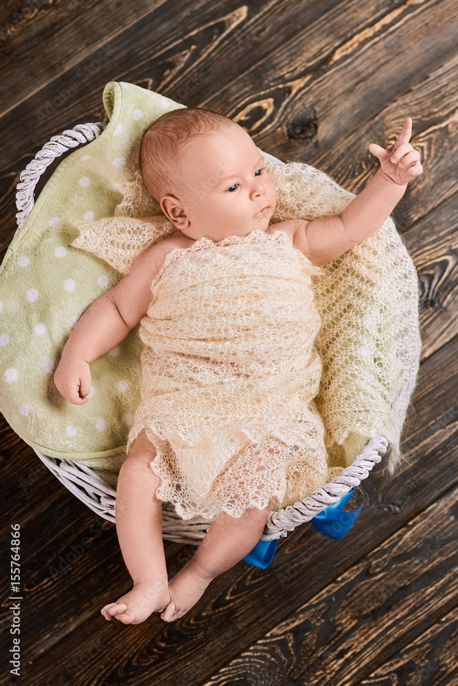 Little kid pointing finger. Child in basket, top view. Baby sign ...