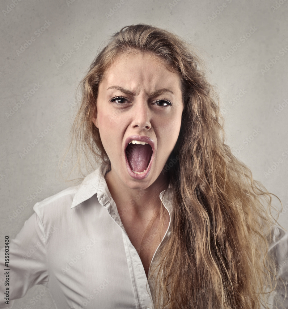 Angry blonde woman screaming Stock Photo | Adobe Stock