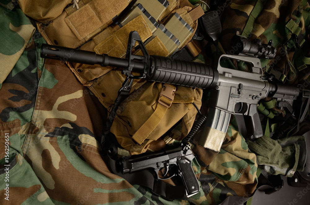 Assault rifle 5.56mm m16 Colt carbine with tactical chest rigs ...