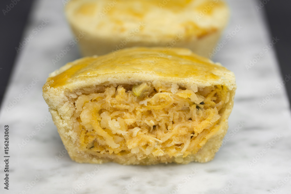 One cut traditional Brazilian mini chicken pie called empada in Carrara ...