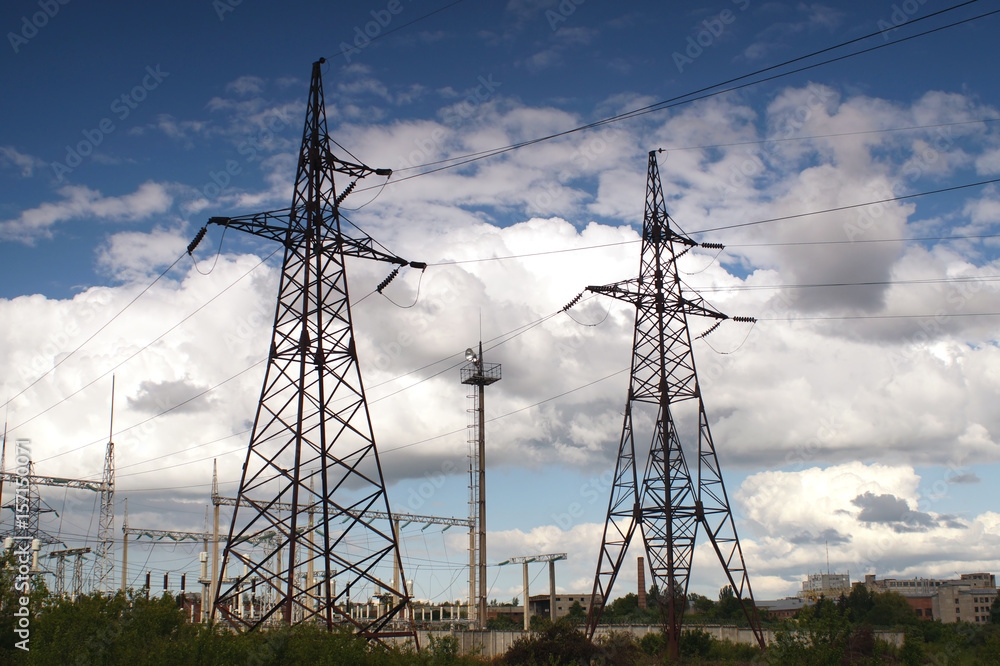 Towers of distribution power lines. High voltage electrical power ...