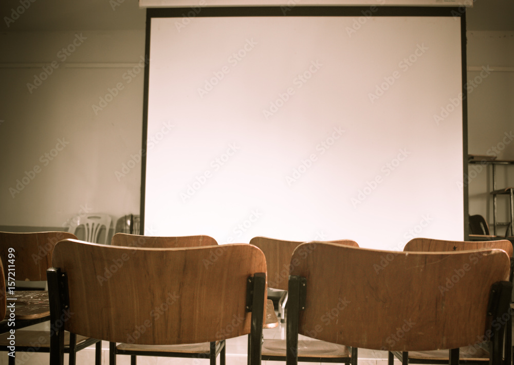 School classroom with old, dirty lecture wooden desk and chair with ...