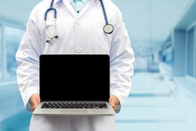 Doctor Holding Laptop Free Stock Photo - Public Domain Pictures